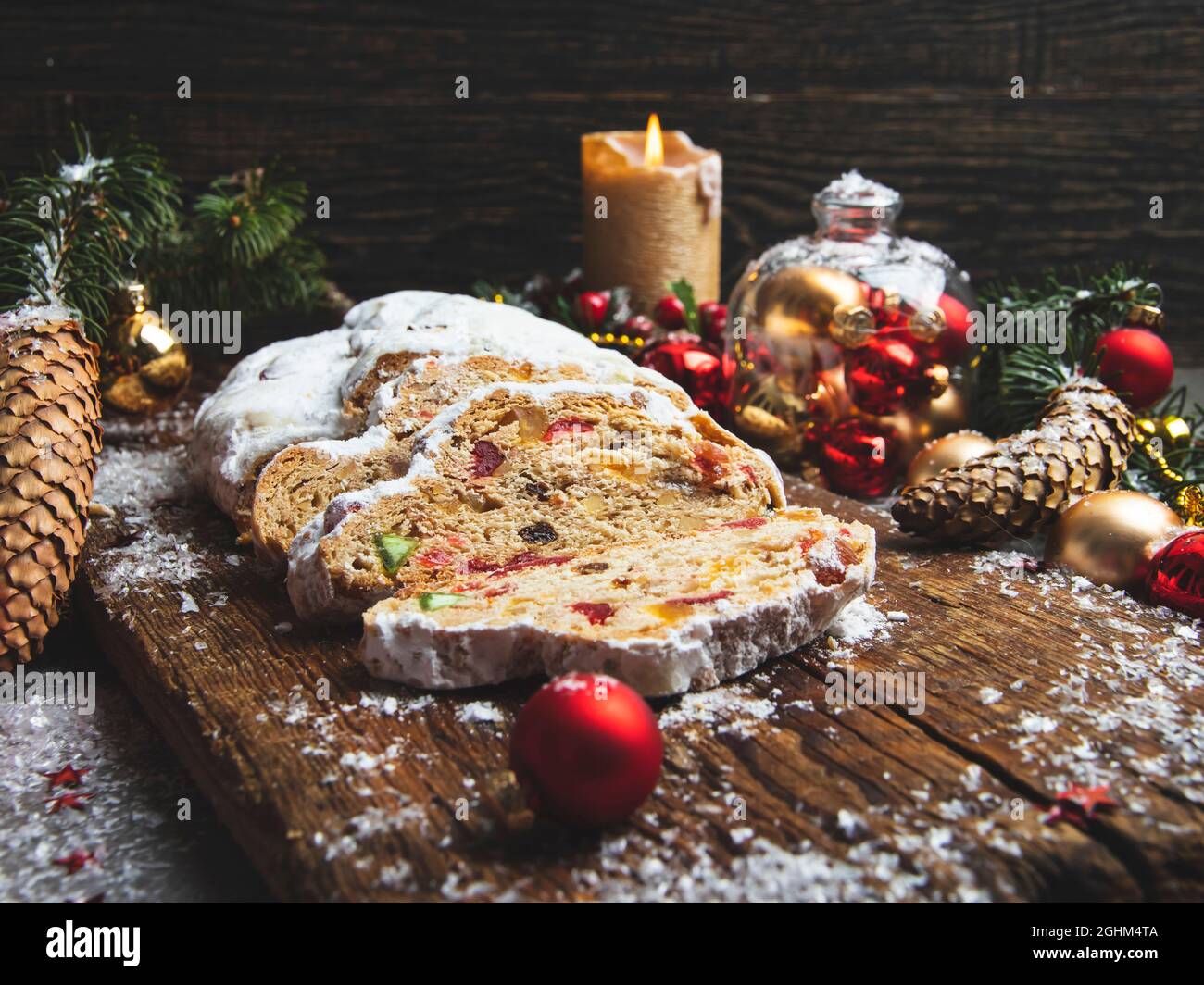 Traditional Christmas stollen, cones, branches tree and Christmas ...