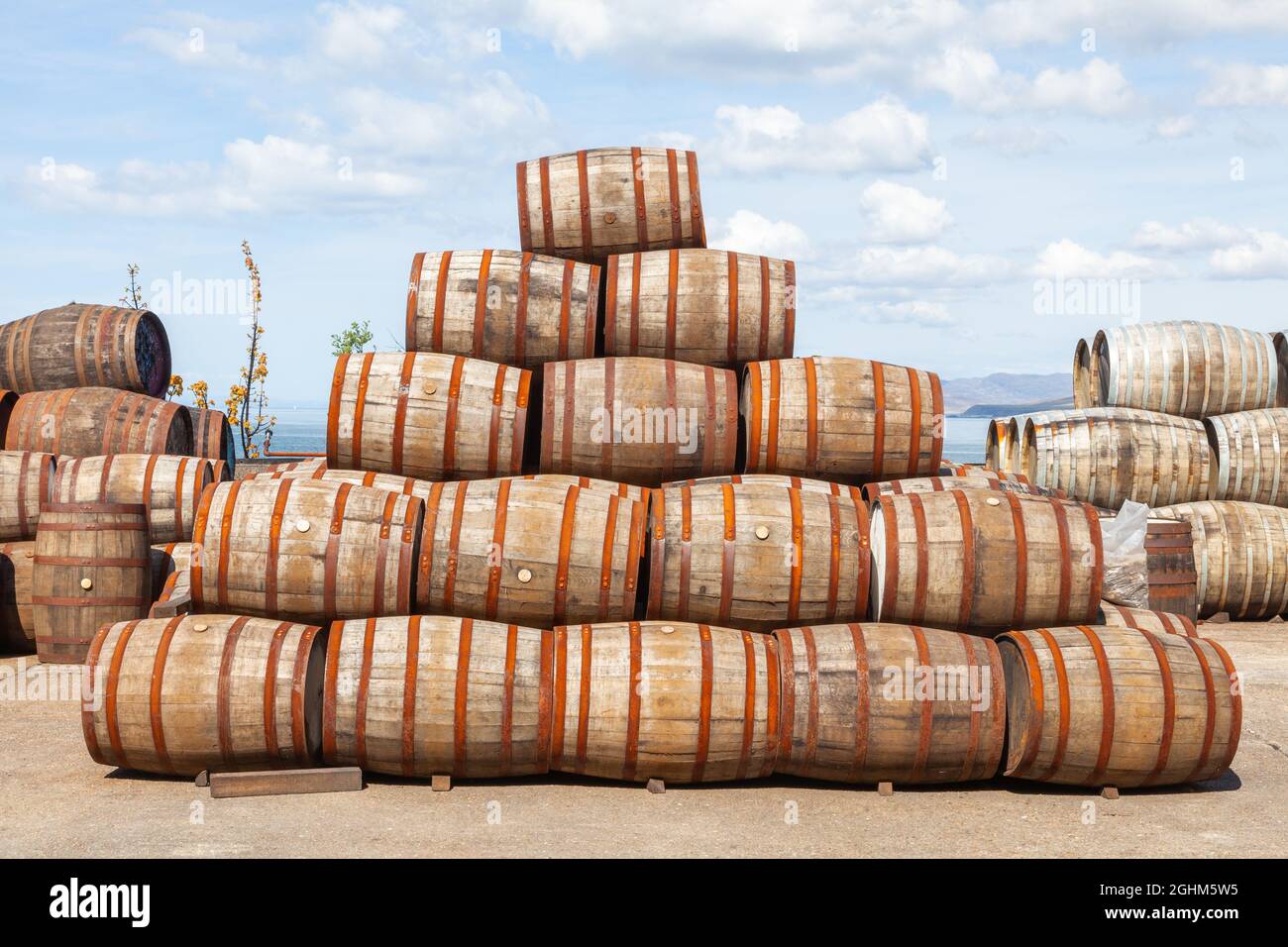 Stacked whiskey barrels on quayside at Islay distillery Stock Photo - Alamy