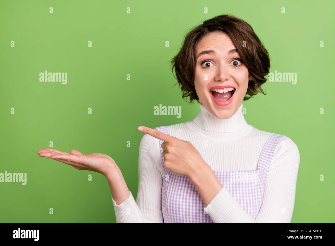Photo of young girl happy positive smile point finger advert advise ...
