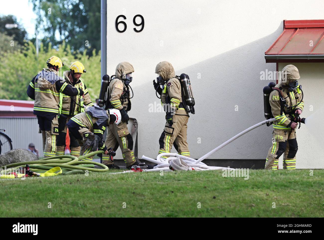 The rescue service on site with smoke divers during a fire in an ...