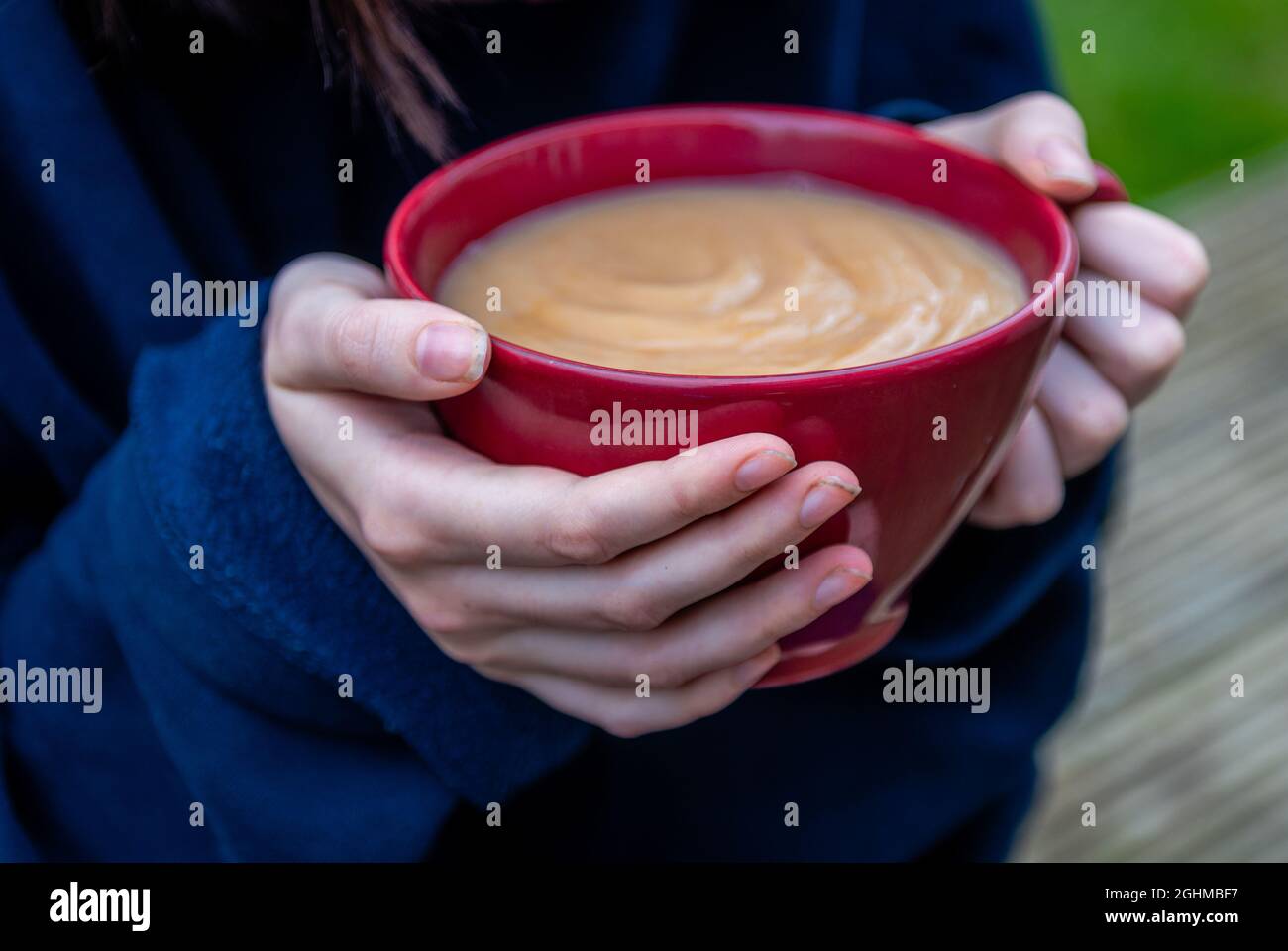 Relaxing with a very large cup of tea Stock Photo - Alamy