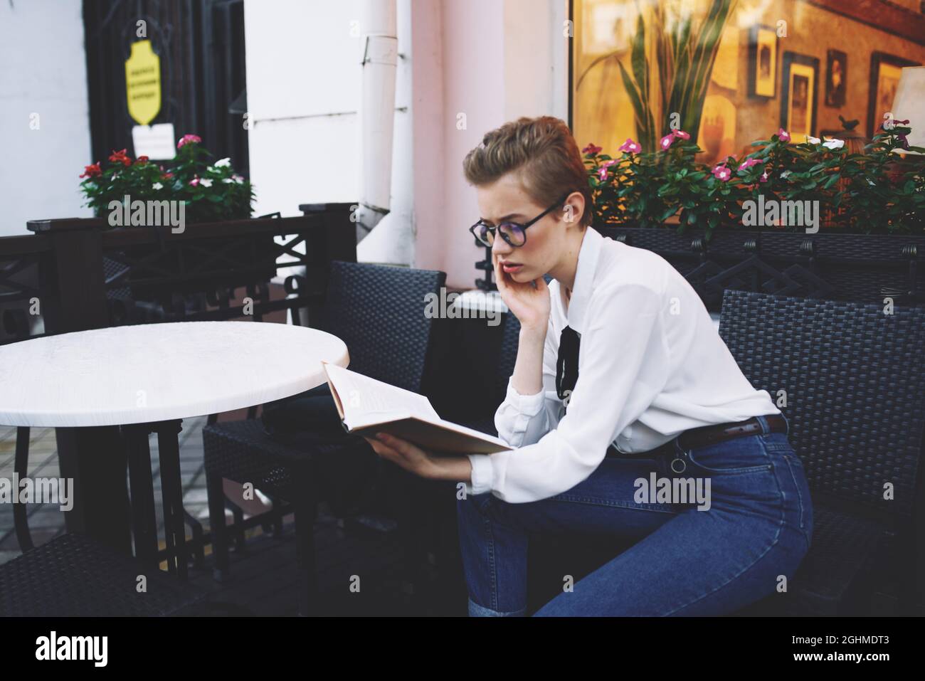 student on the street with a book in his hands Lifestyle Stock Photo ...