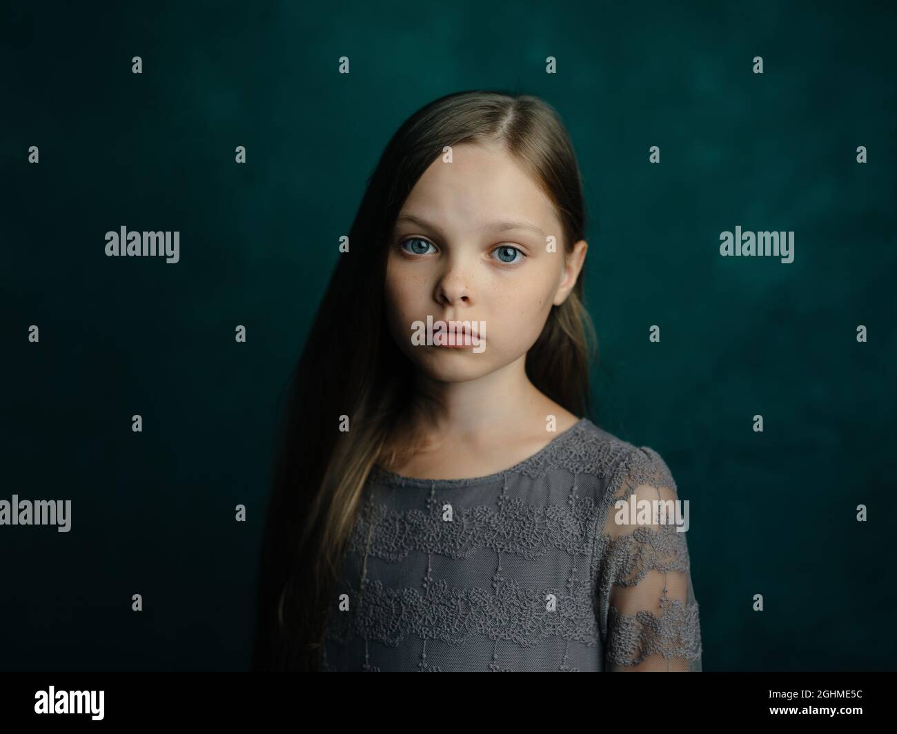 little girl long hair posing green background Stock Photo - Alamy