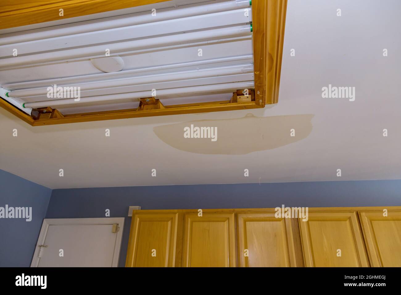 Ceiling kitchen in damage caused by a leaking water pipe Stock Photo ...