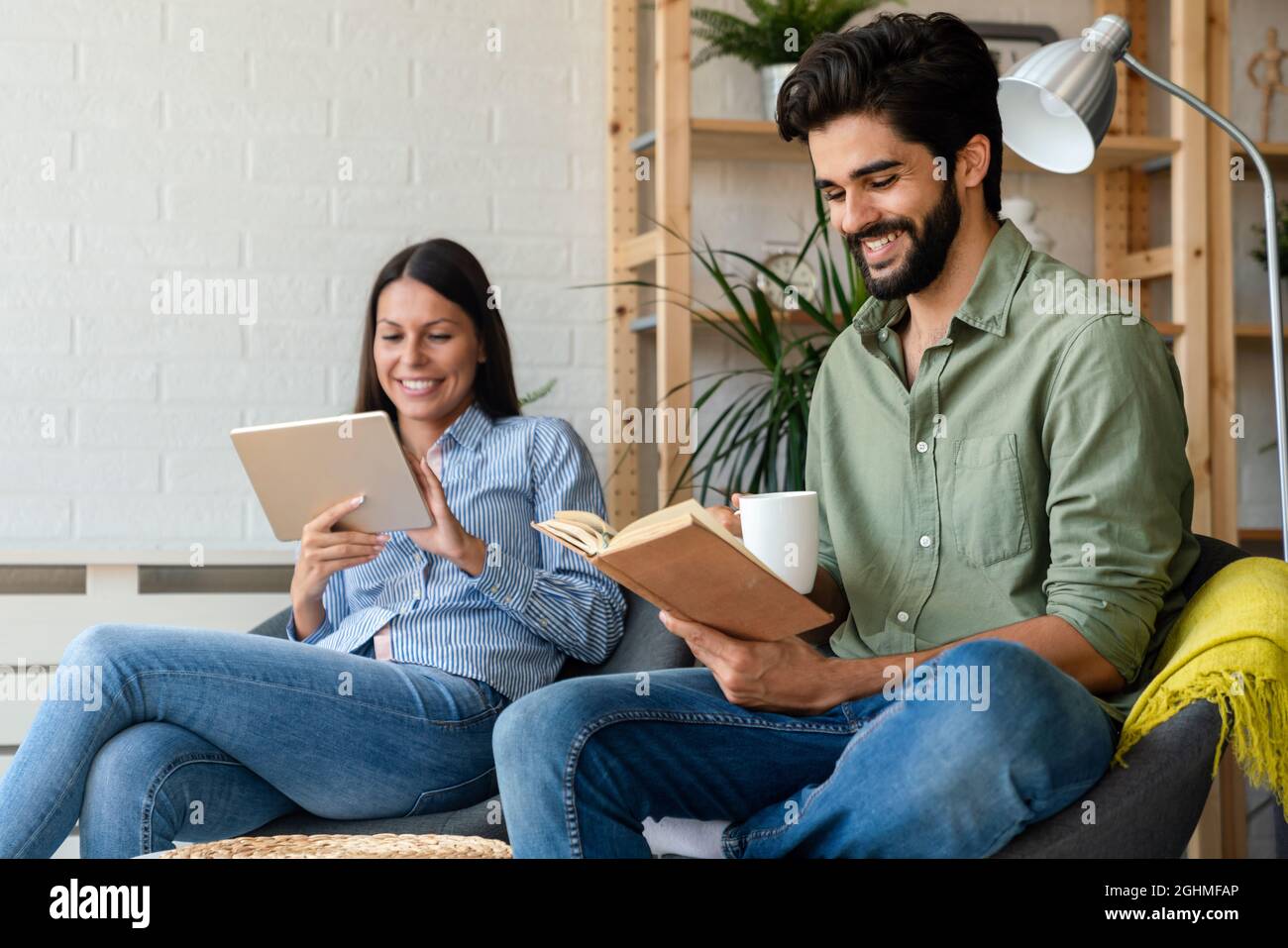 Spending nice time at home. Couple bonding to each other and smiling ...
