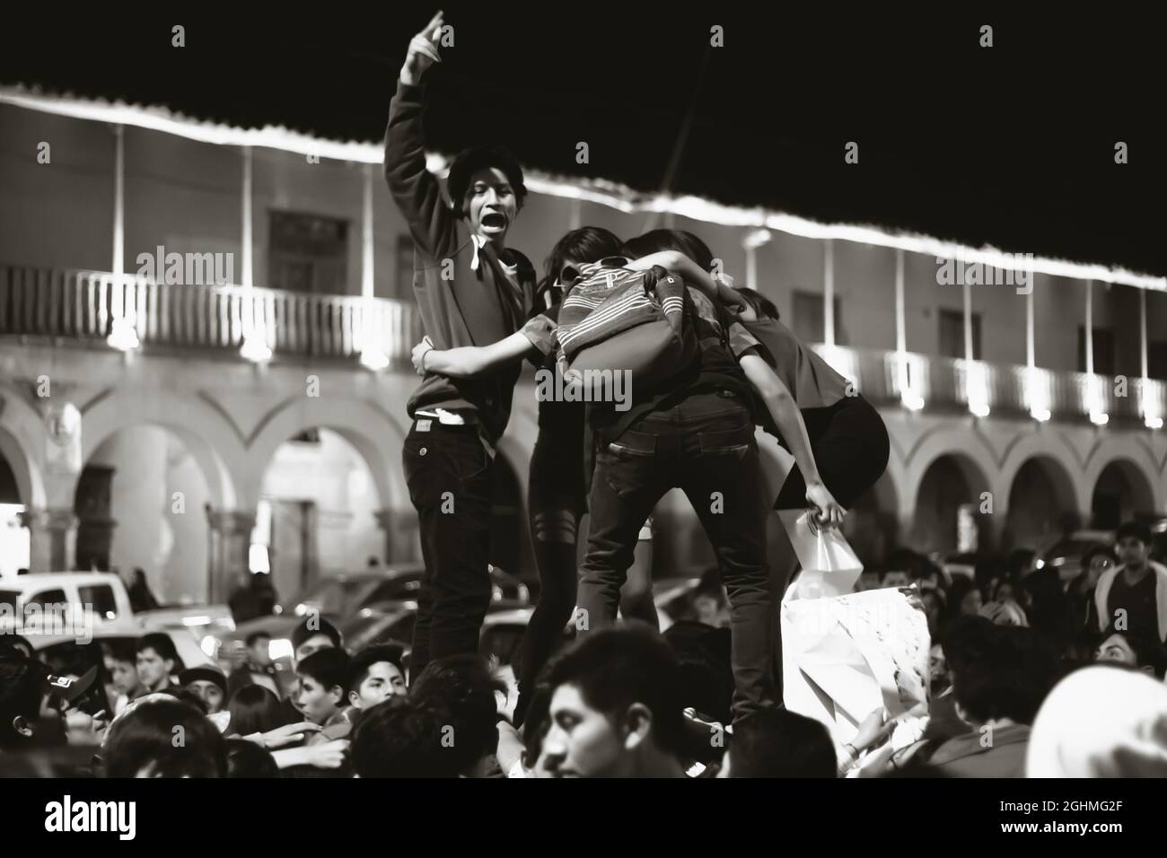 AYACUCHO, PERU - Jul 15, 2019: A group of young people jumping and ...