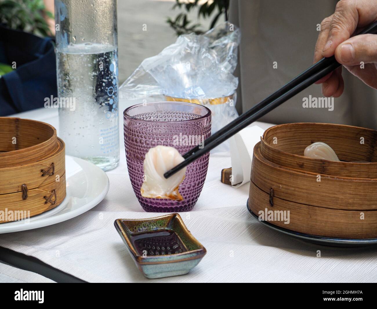 Senior man eating Chinese dumpling outdoors Stock Photo - Alamy