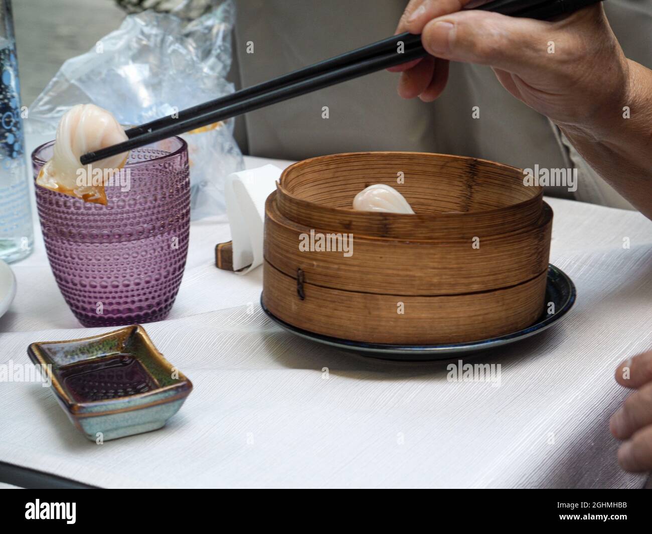 Senior man eating Chinese dumpling outdoors Stock Photo - Alamy