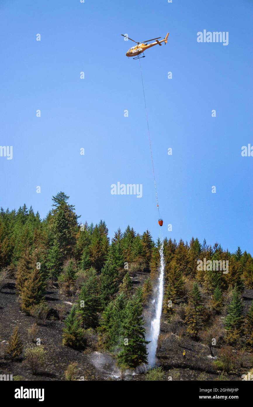 COLDSTREAM, CANADA - Jul 27, 2021: A firefighting plane over beautiful ...