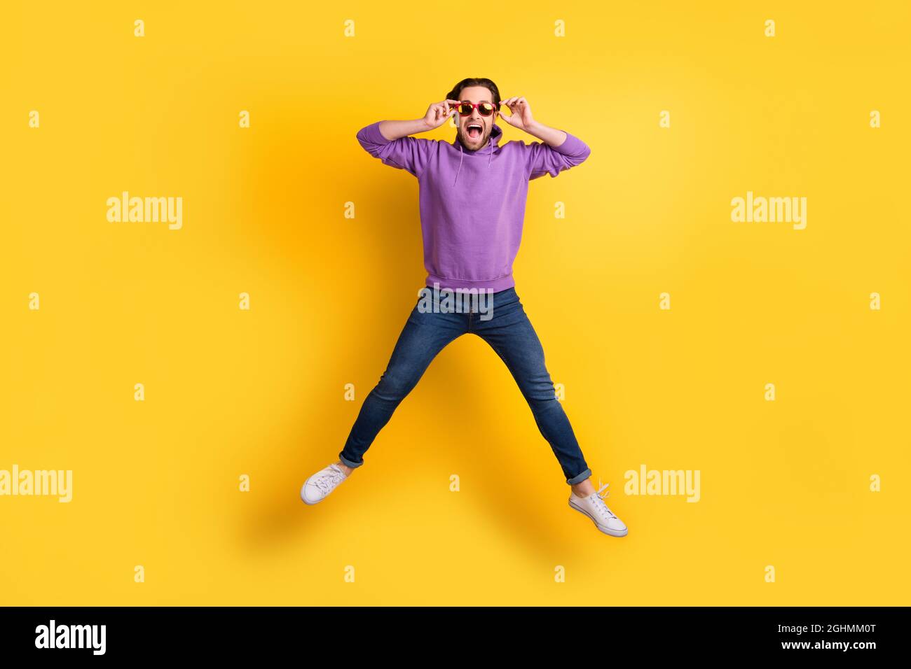 Full length photo of young excited man happy positive smile jump up ...