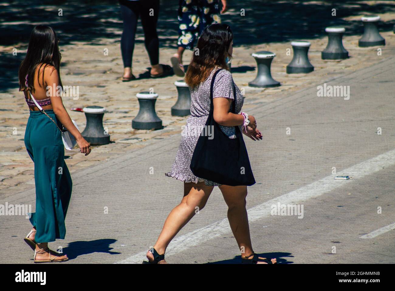 Seville Spain September 04, 2021 Pedestrians walking in the street ...