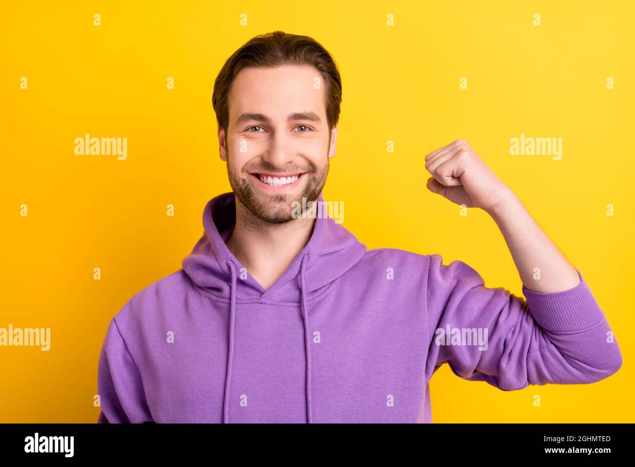 Photo of young guy happy positive smile show hand muscles strong ...