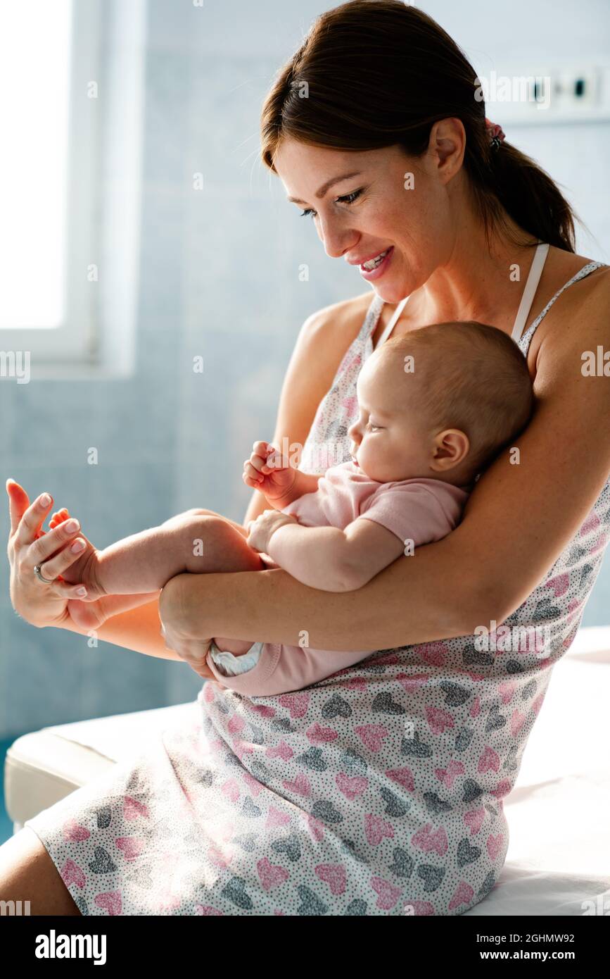 Beautiful mother and her newborn baby together. Love, happiness, family ...