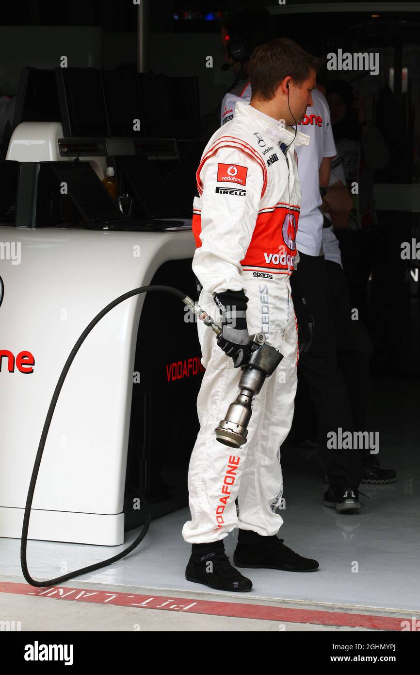McLaren mechanic with a wheel changing gun Stock Photo - Alamy