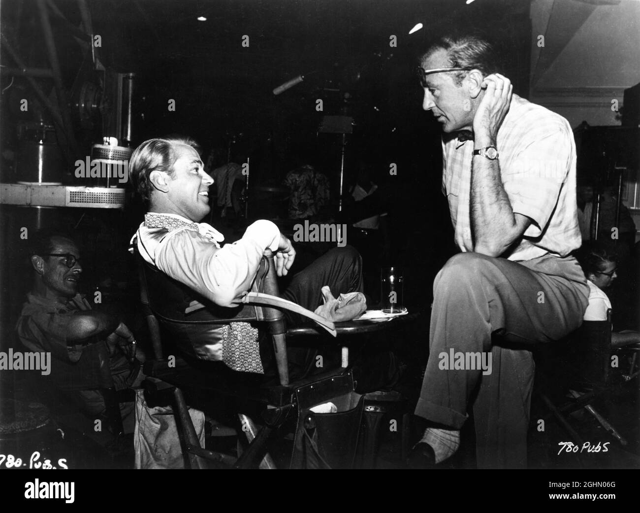 ALAN LADD with Set Visitor GARY COOPER on set candid during filming of ...