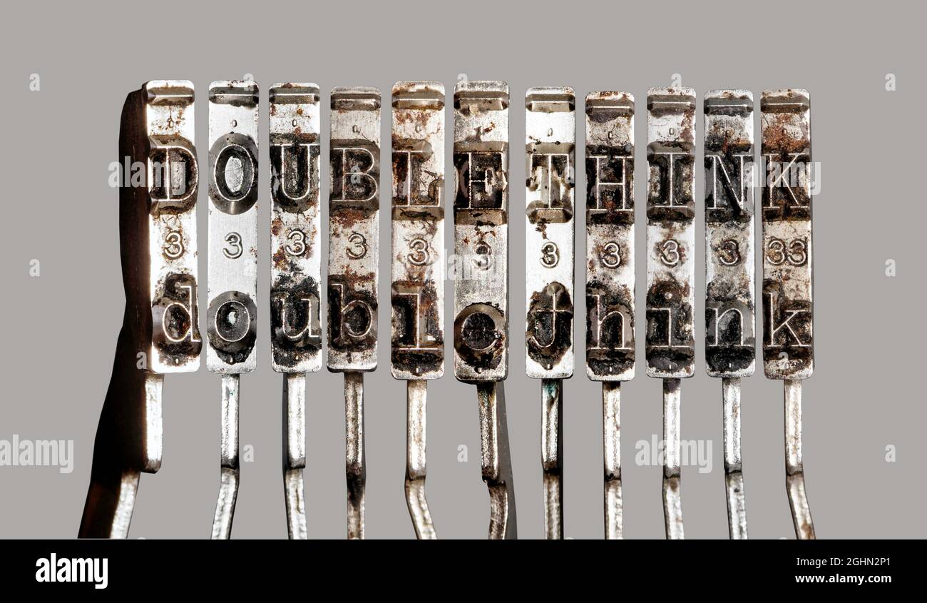 vintage old typewriter hammers with the word doblethink Stock Photo - Alamy
