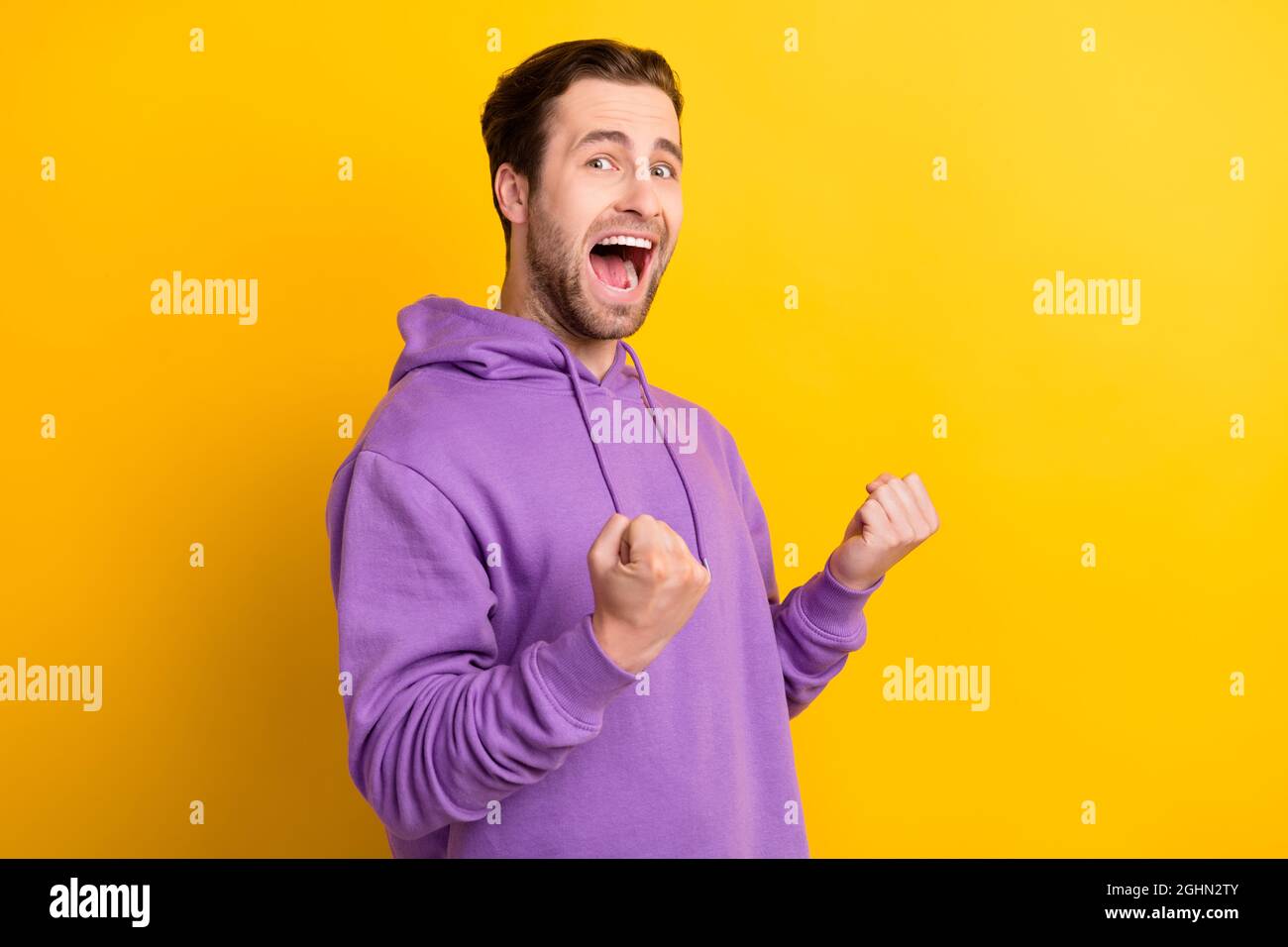 Photo of cheerful positive guy yell goal rejoice celebrate victory wear ...