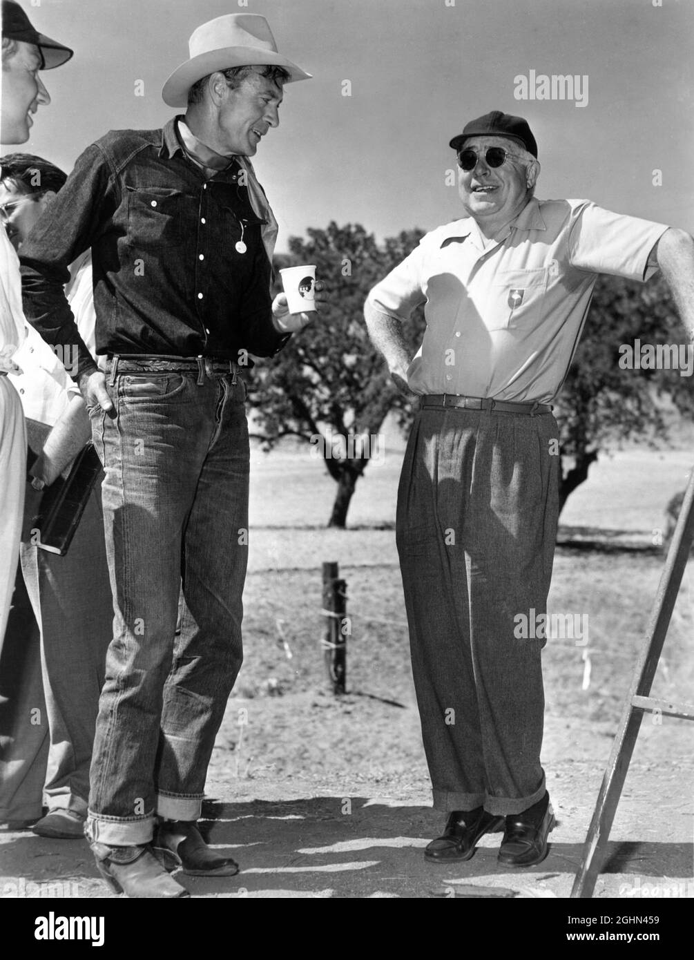 GARY COOPER and Director CLARENCE BROWN on set candid during filming of ...