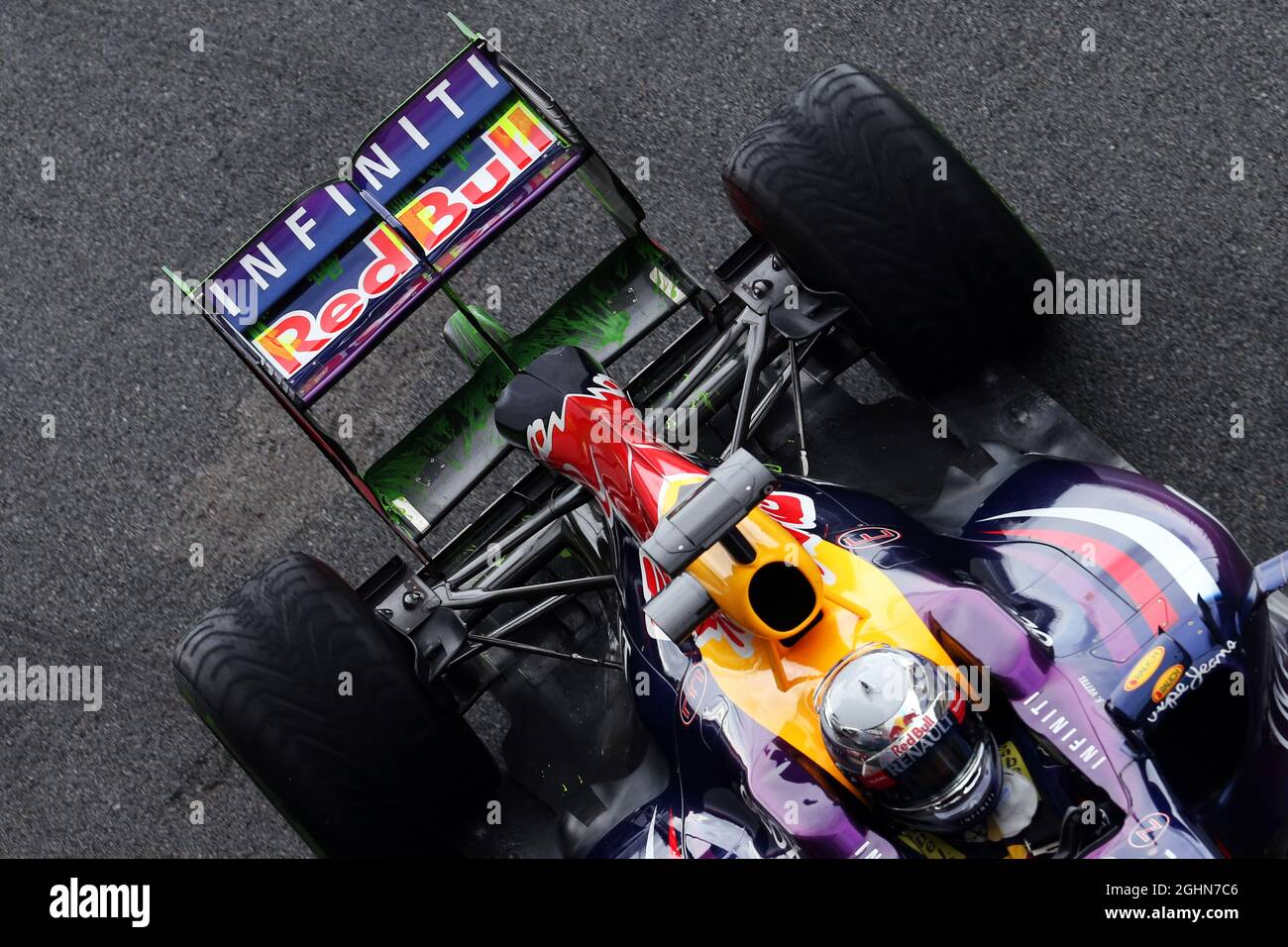 Sebastian Vettel (GER) Red Bull Racing RB9 returns to the pits running ...