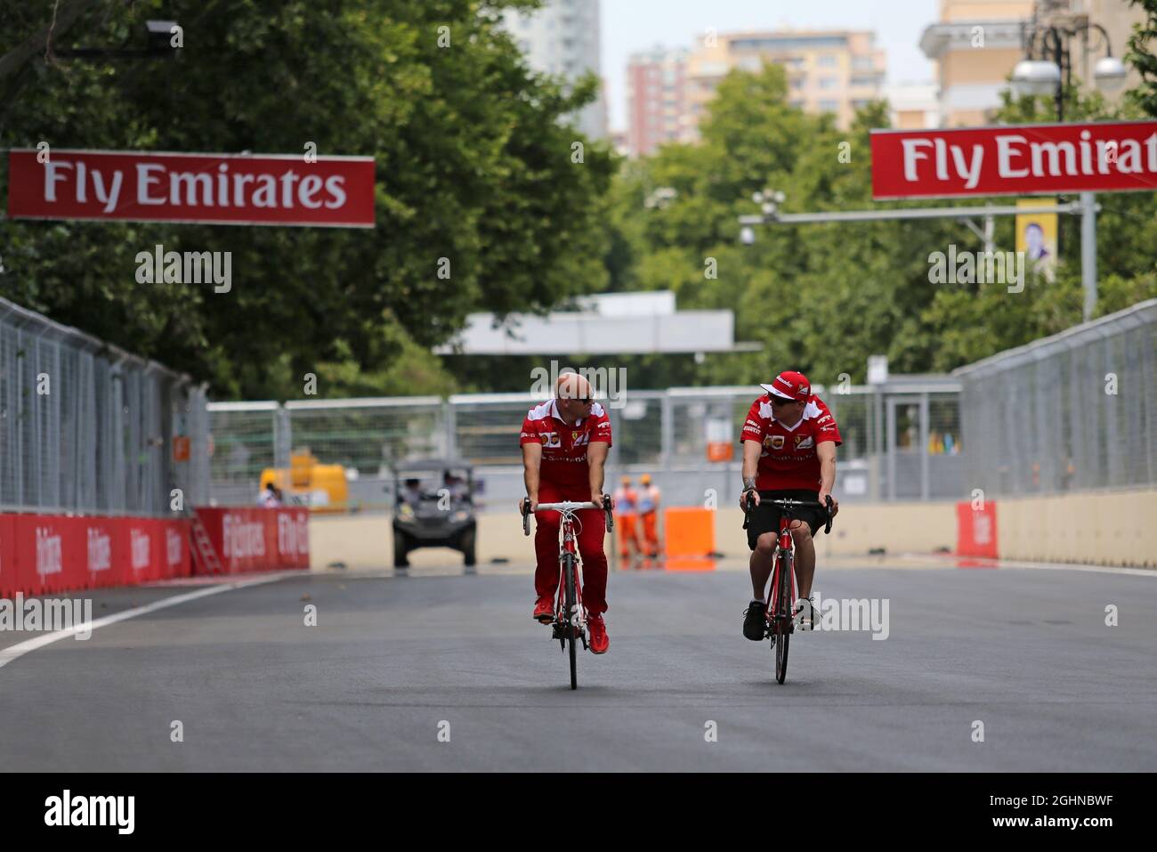 Kimi Raikkonen (FIN) Ferrari rides the circuit with Mark Arnall (GBR ...