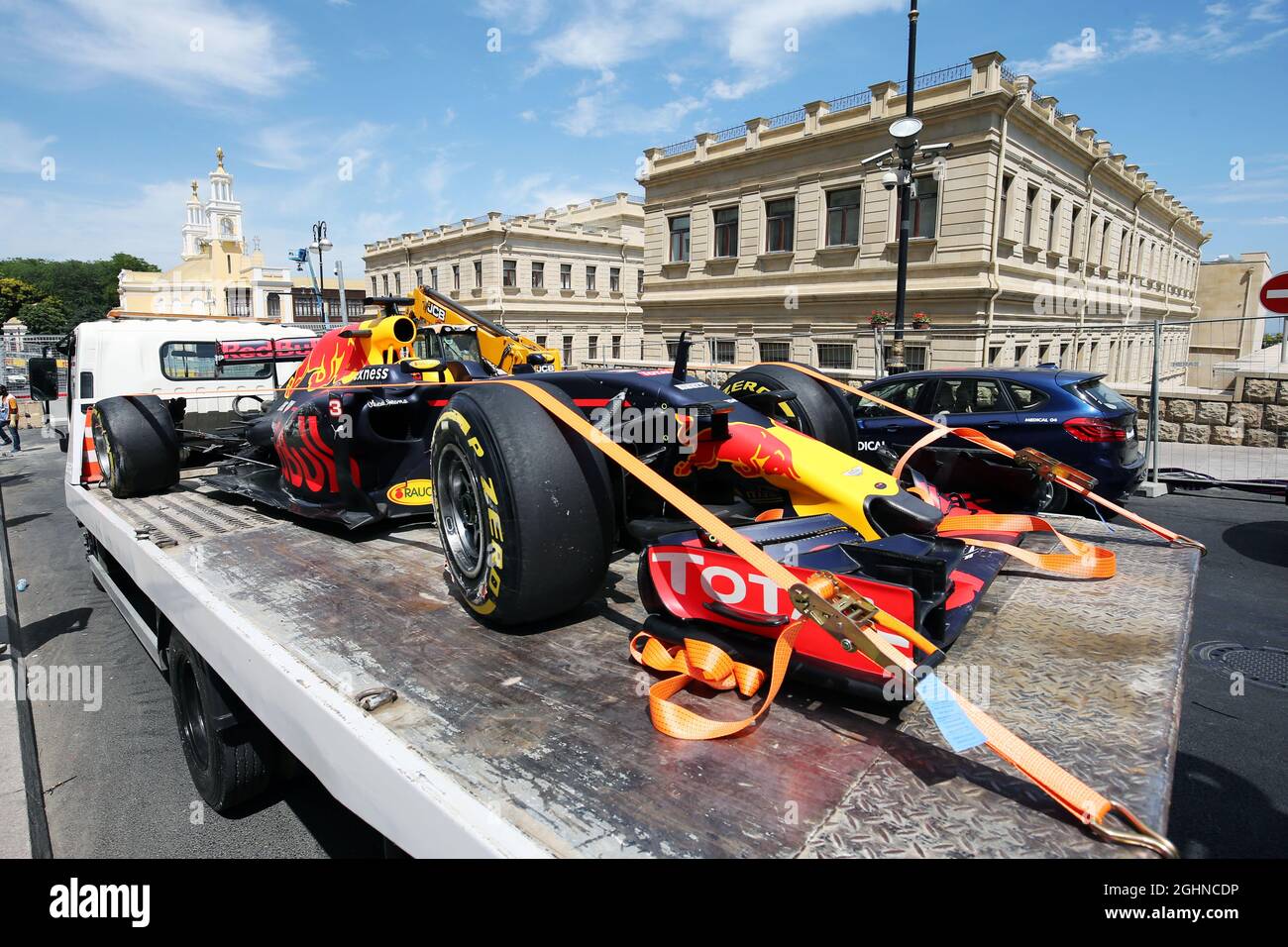 The damaged Red Bull Racing RB12 of Daniel Ricciardo (AUS) is recovered ...