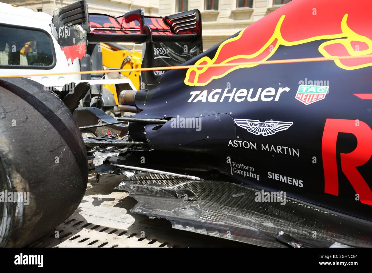 The damaged Red Bull Racing RB12 of Daniel Ricciardo (AUS) is recovered ...