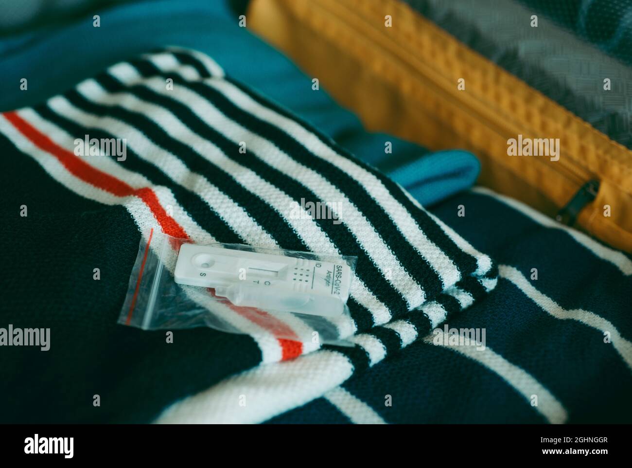 closeup of a covid-19 antigen diagnostic test kit in a suitcase, packed ...