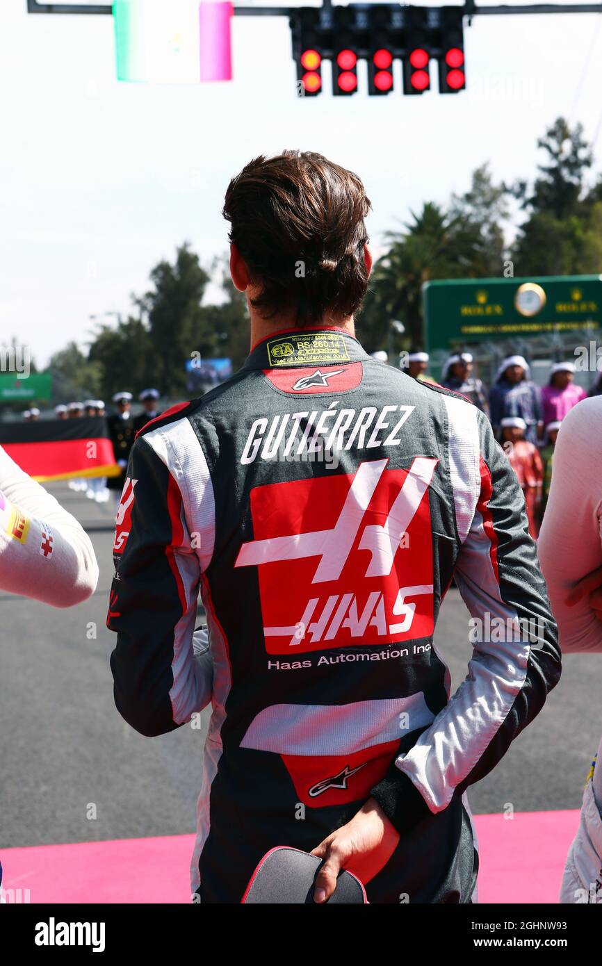 Esteban Gutierrez (MEX) Haas F1 Team as the grid observes the national ...