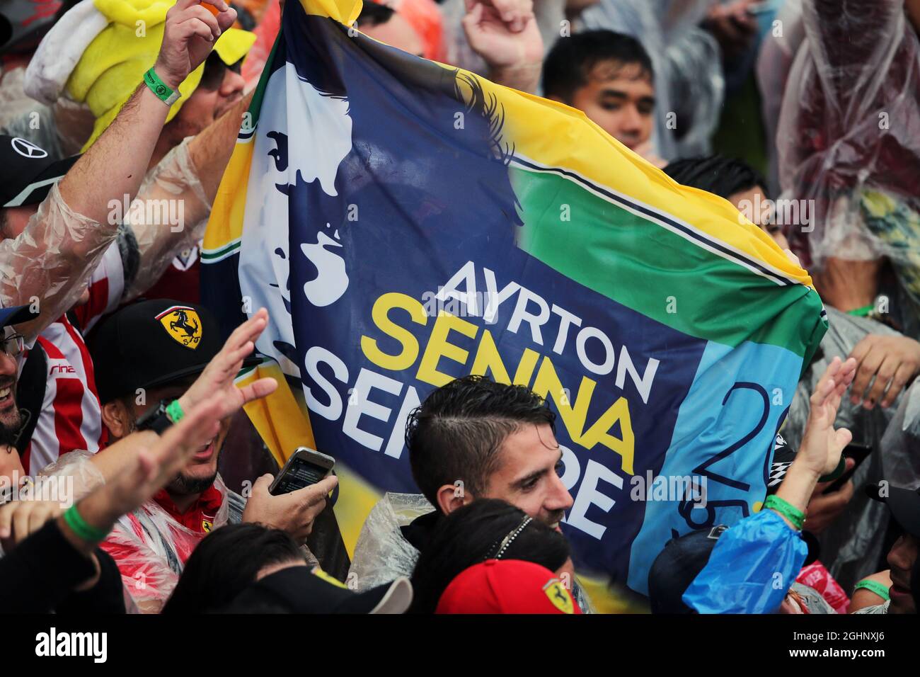 A Ayrton Senna banner with fans at the podium. Brazilian Grand Prix ...