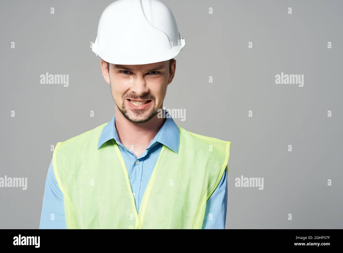 Man in working form construction work isolated background Stock Photo ...