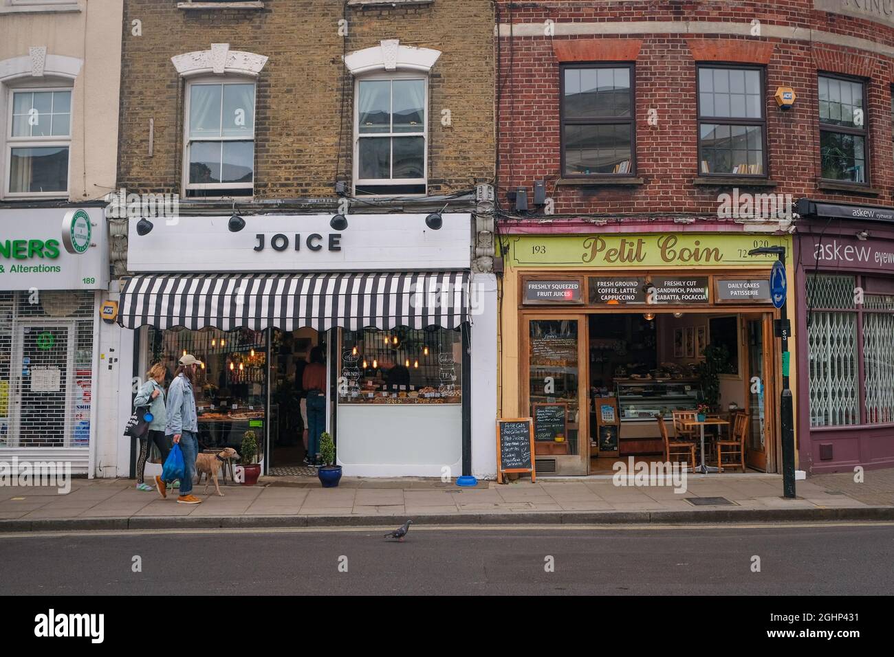 London- September 2021: Stoke Newington high street shops, a trendy ...