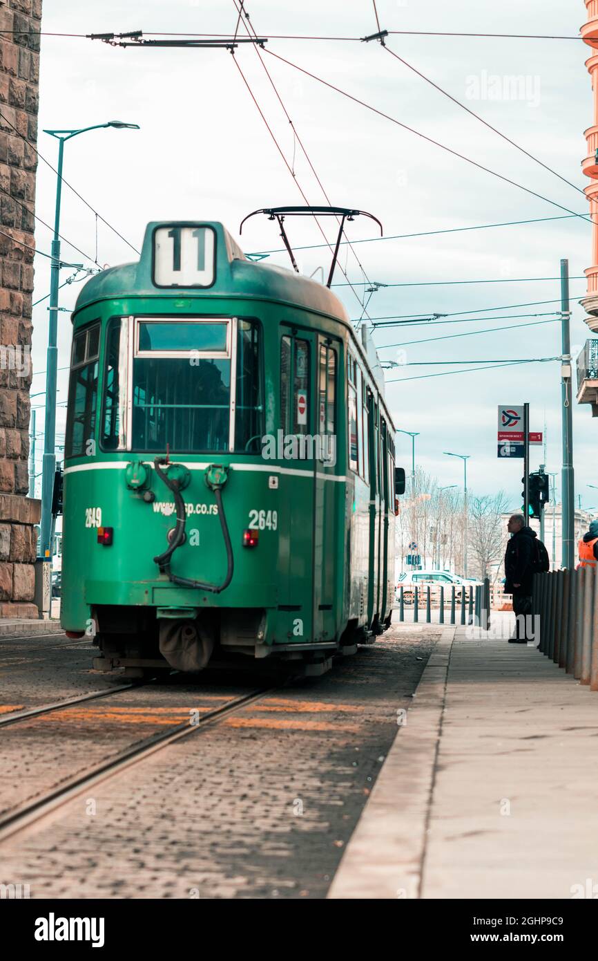 Green Swiss tram waiting on a city station for passengers Stock Photo ...