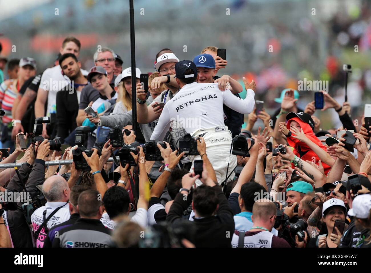 Race winner Lewis Hamilton (GBR) Mercedes AMG F1 crowd surfs with the ...