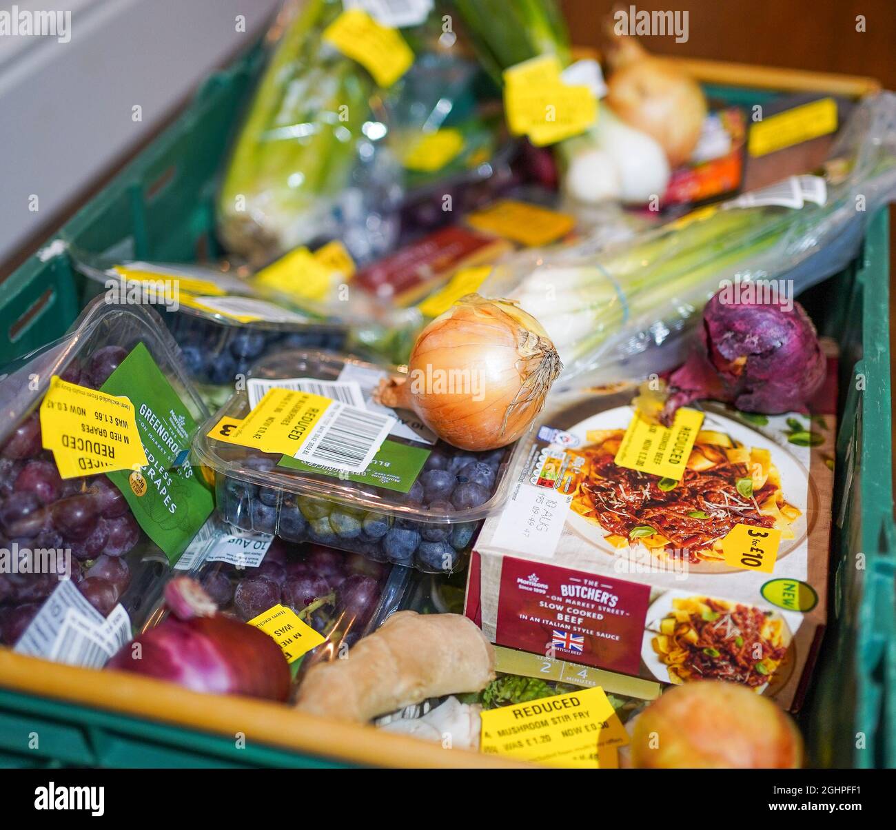 Thrifty shopping. Saving money. Groceries/ food products with yellow ...