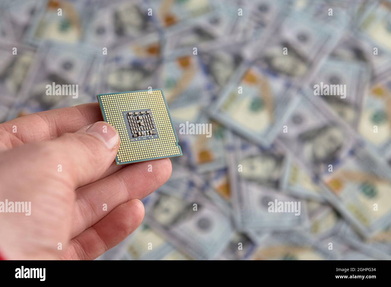 Circuit board chips, electronics, against the background of money. The ...
