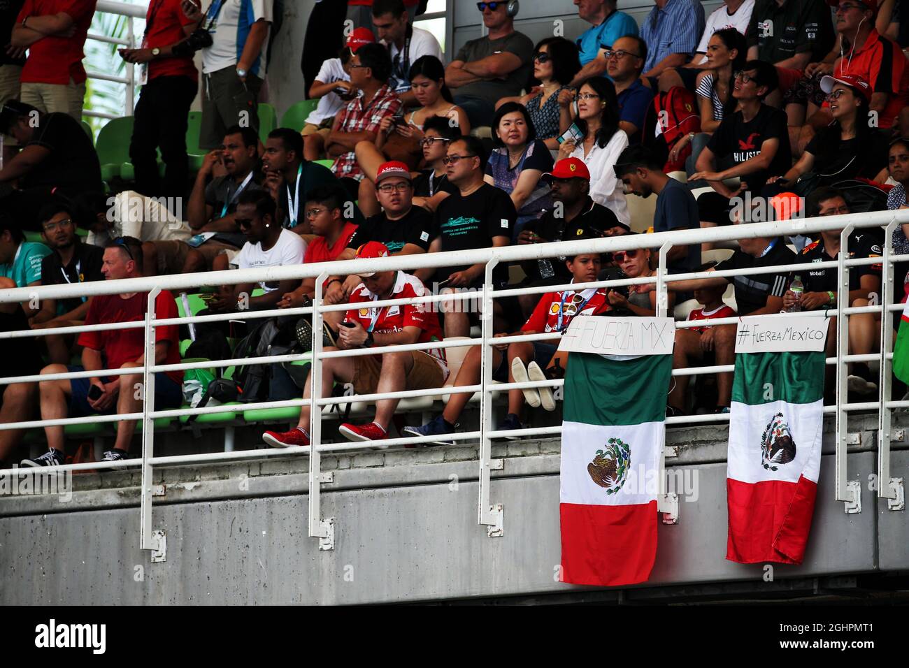 Fans in the grandstand and Mexican flags with a message of support ...