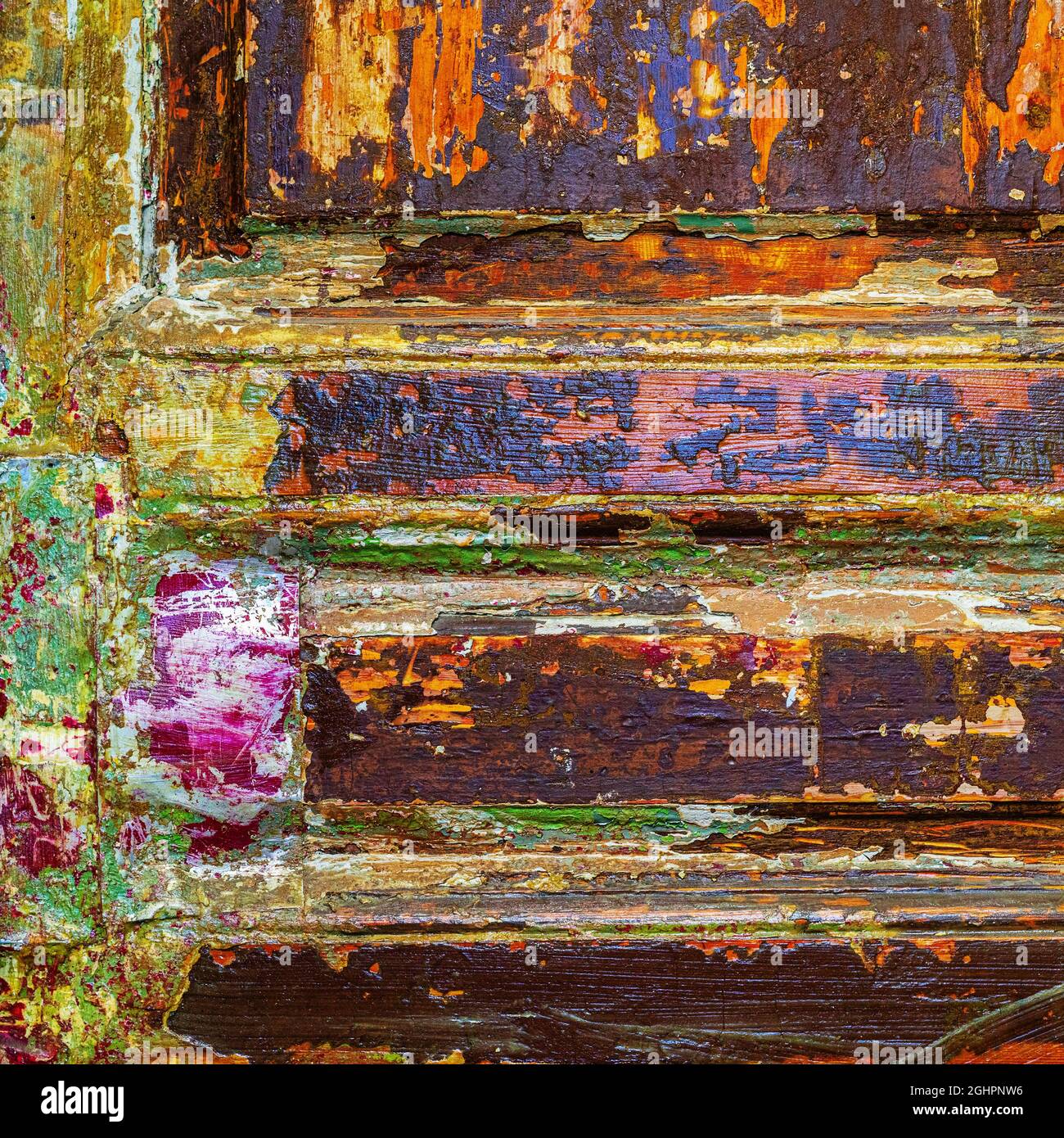 Stained and splattered with bright paint wooden wall. Textured Colorful ...