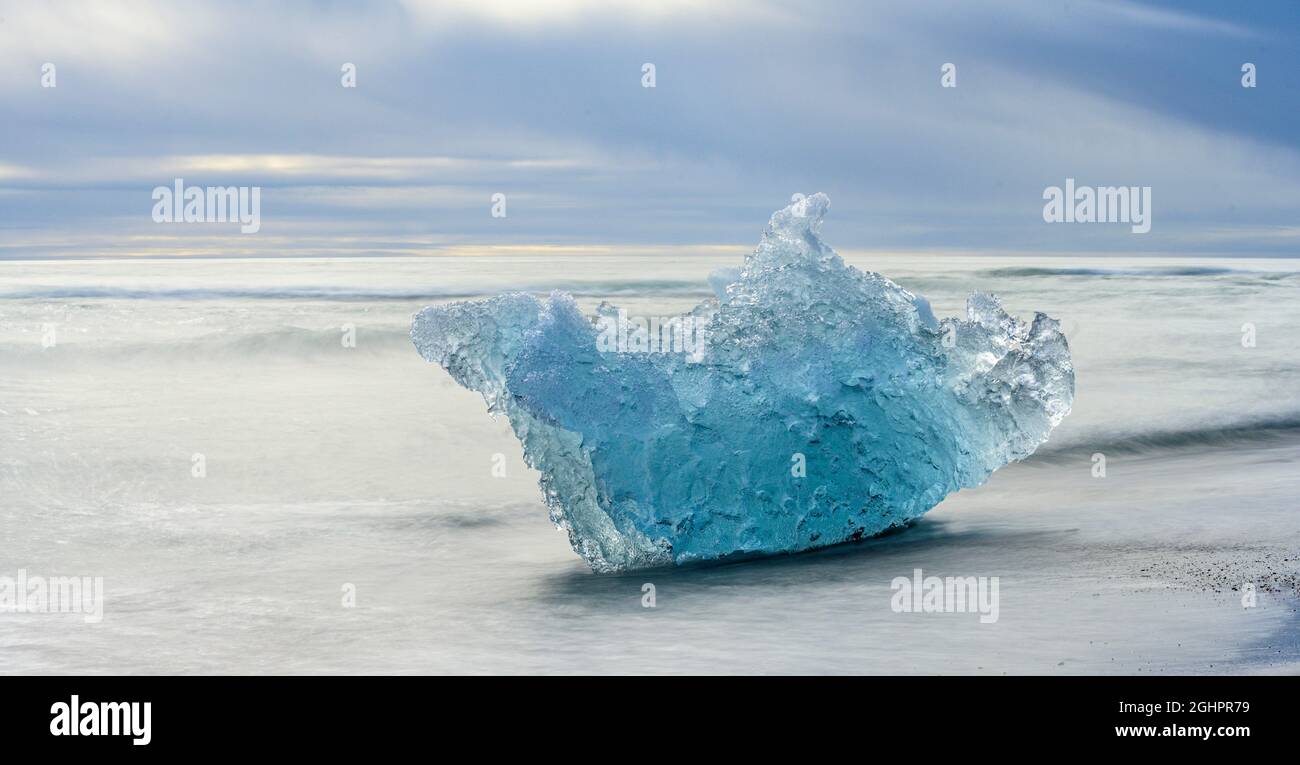 Iceberg on the black lava beach Diamond beach, Joekulsarlon, Austurland ...