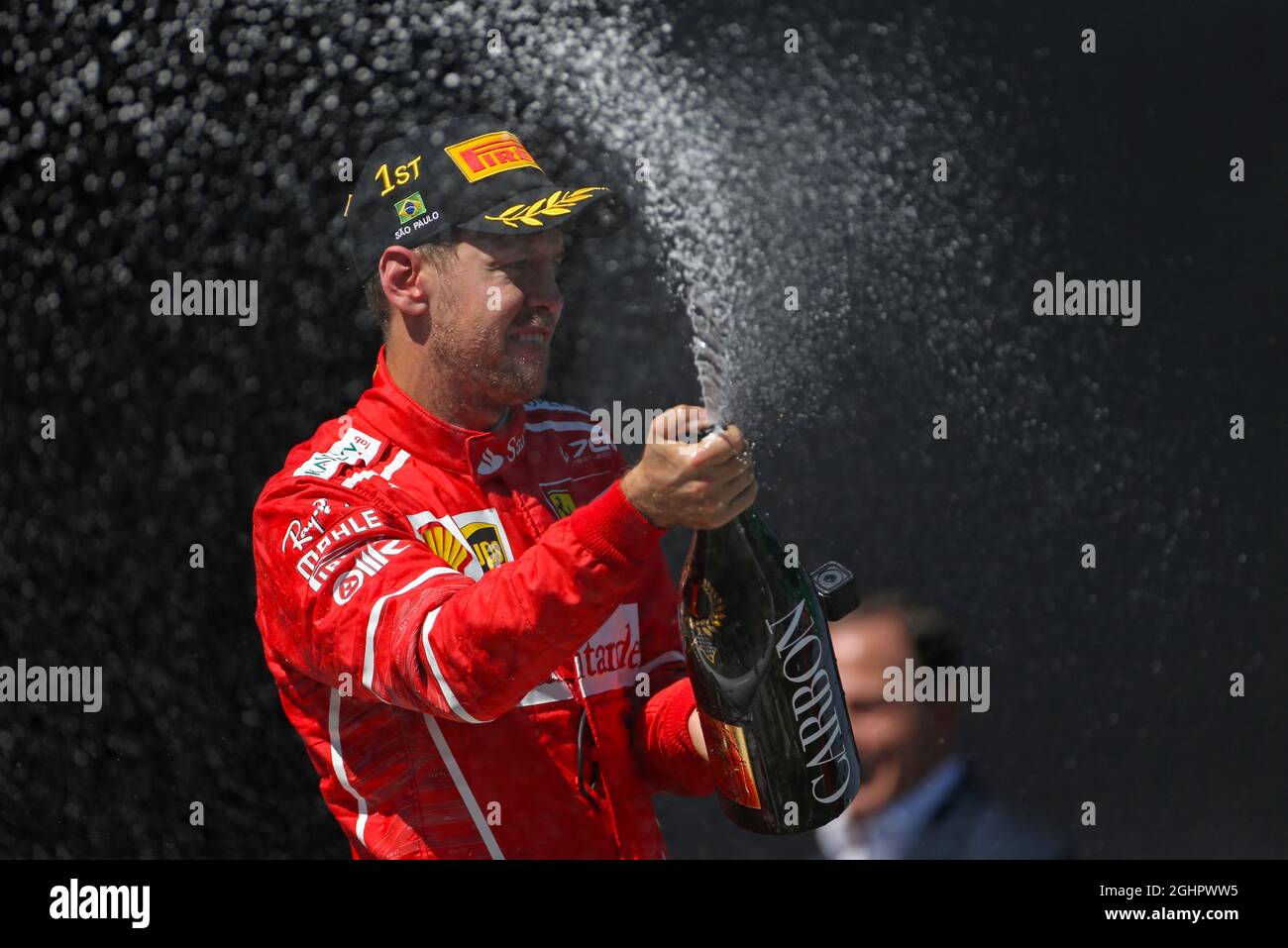 Race winner Sebastian Vettel (GER) Ferrari celebrates on the podium. 12 ...