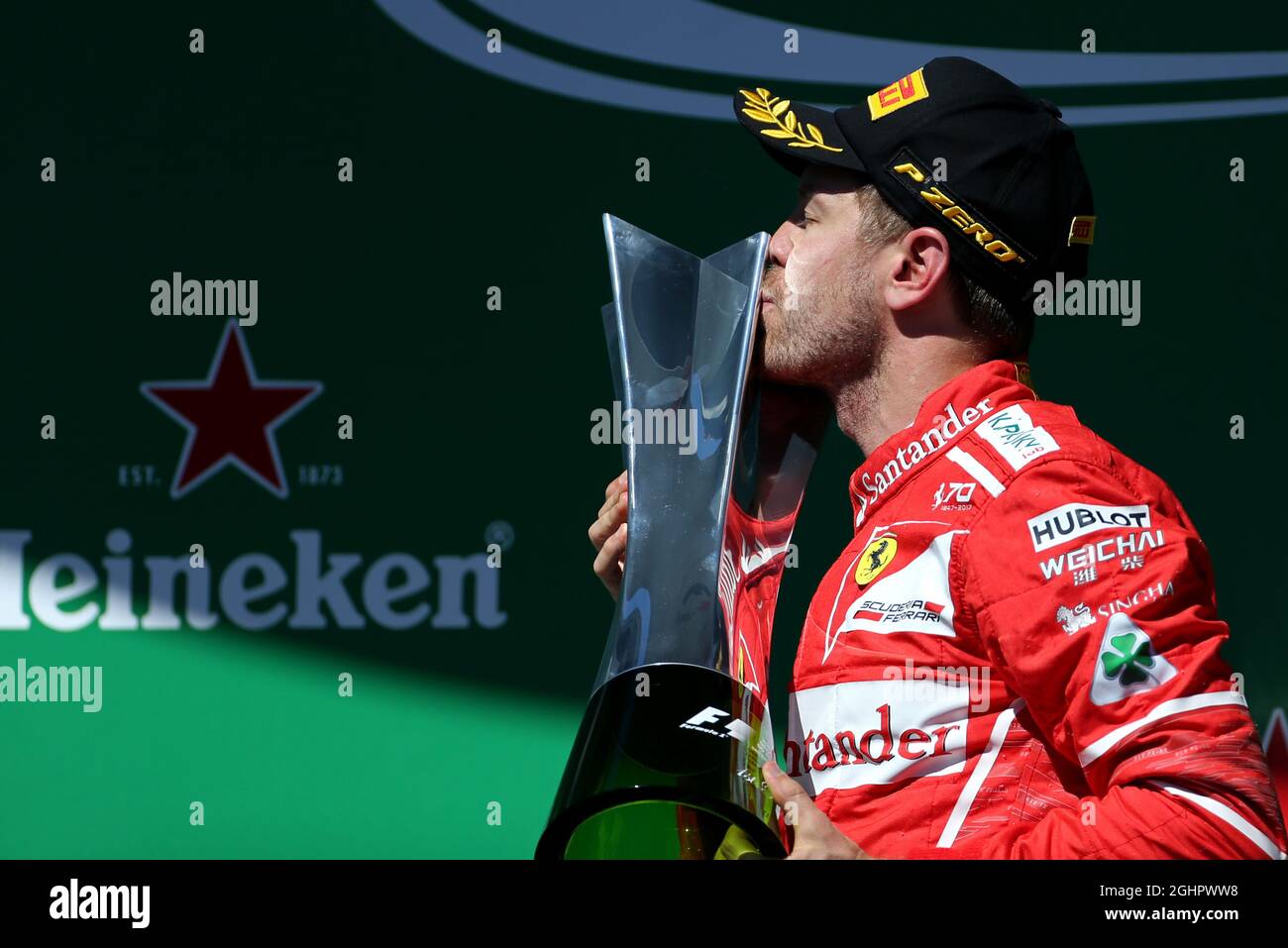 Race winner Sebastian Vettel (GER) Ferrari celebrates on the podium. 12 ...
