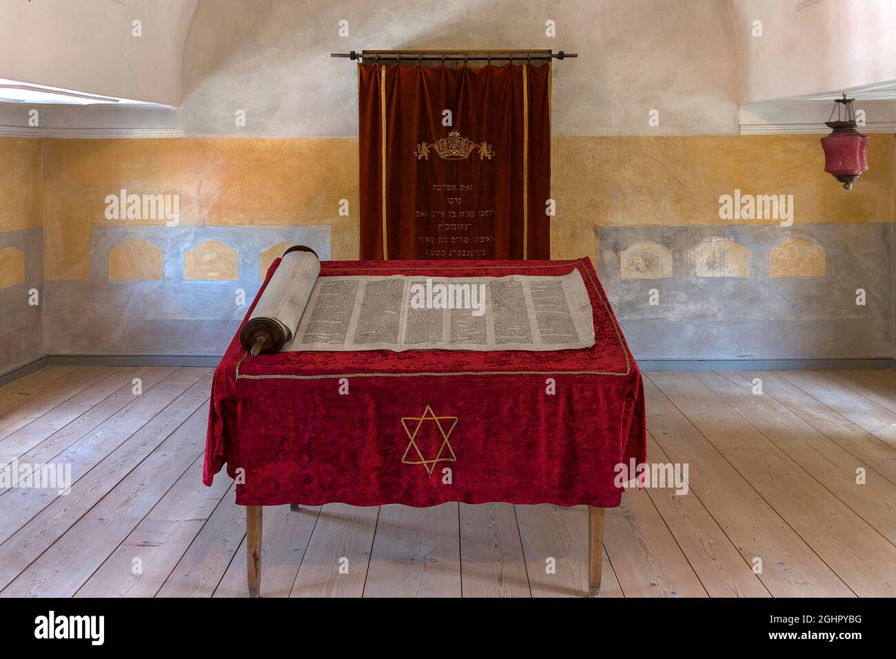 Table with Torah scroll and Torah cupboard in the synagogue in the ...