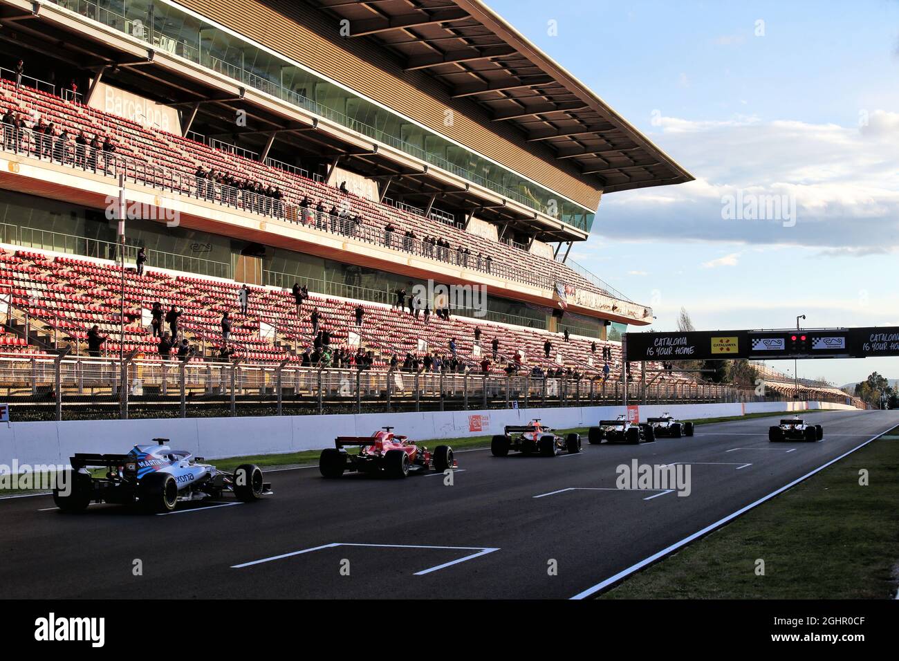 Cars line up to practice a start at the end of the day's running. 06.03 ...