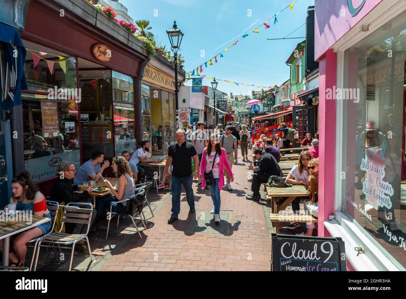 Street of pubs and restaurants with colourful flags, Old Town, Brighton ...