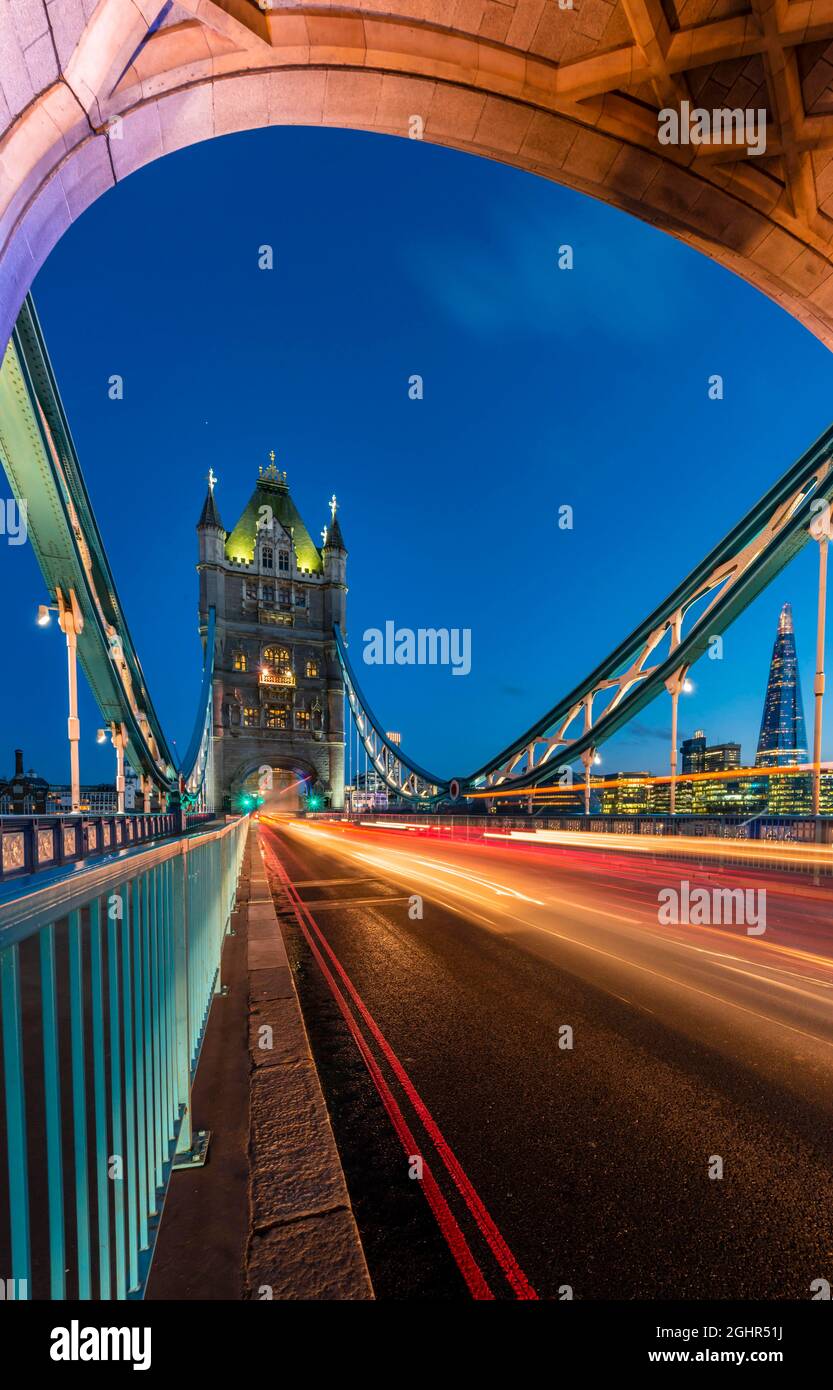 Tower Bridge in the evening, light traces of passing cars, London ...