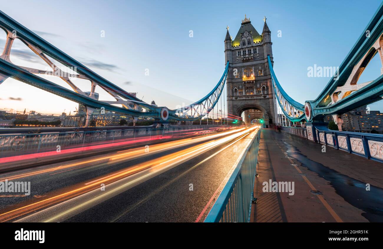 Tower Bridge in the evening, light traces of passing cars, London ...