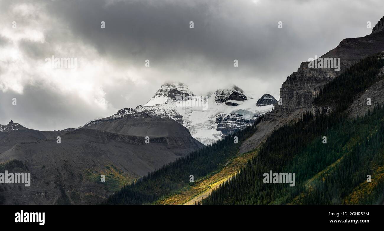 Cloudy snow-capped peaks, Mount Charlton and Mount Unwin, autumnal ...