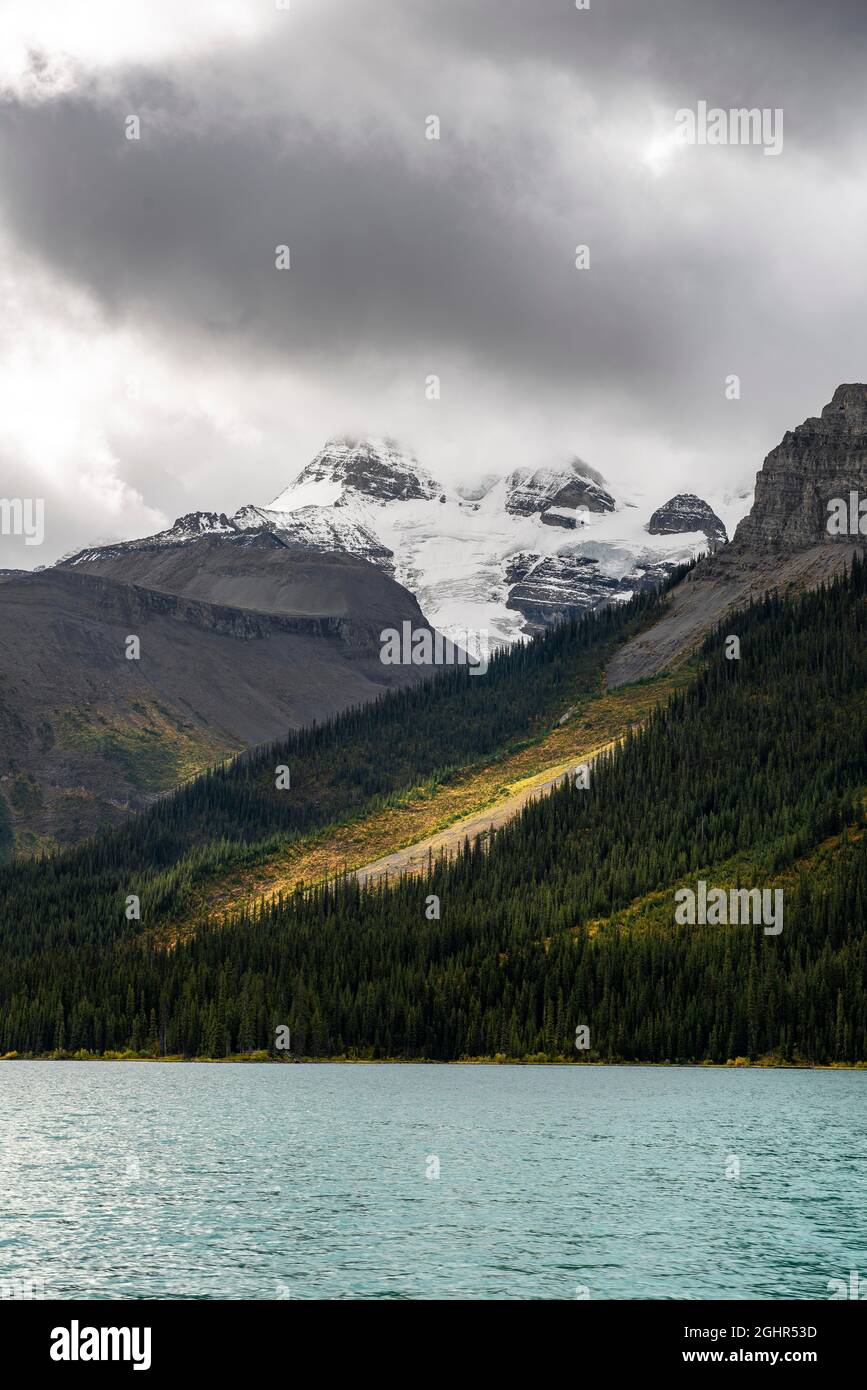 Cloudy snow-capped peaks, Mount Charlton and Mount Unwin, autumnal ...