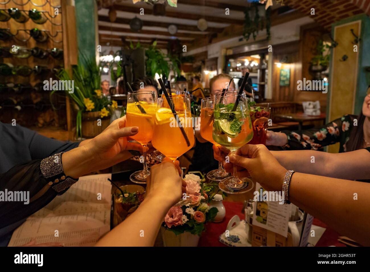 toast cheers with cocktails in a restaurant with friends Stock Photo ...