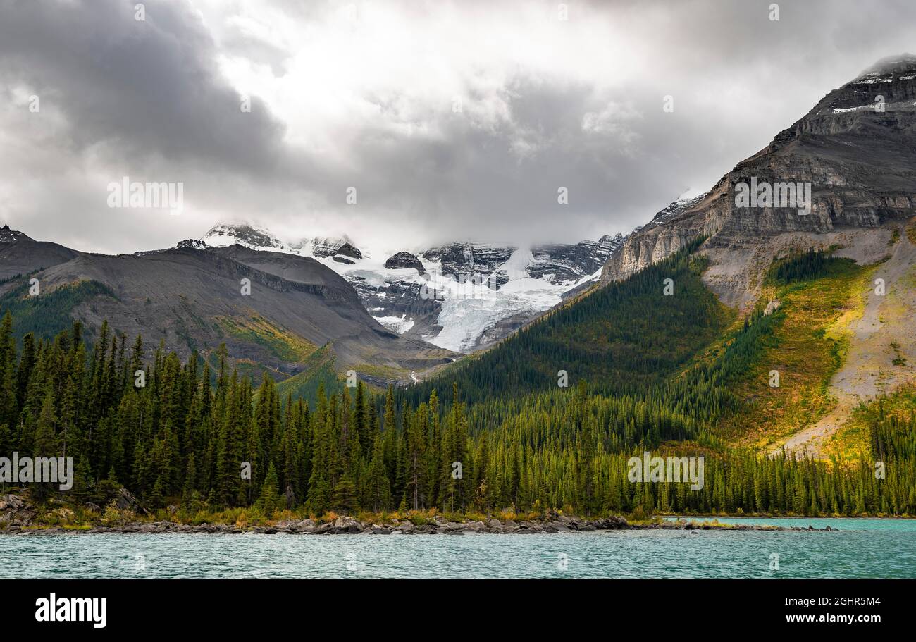 Cloudy snow-capped peaks, Mount Charlton and Mount Unwin, autumnal ...
