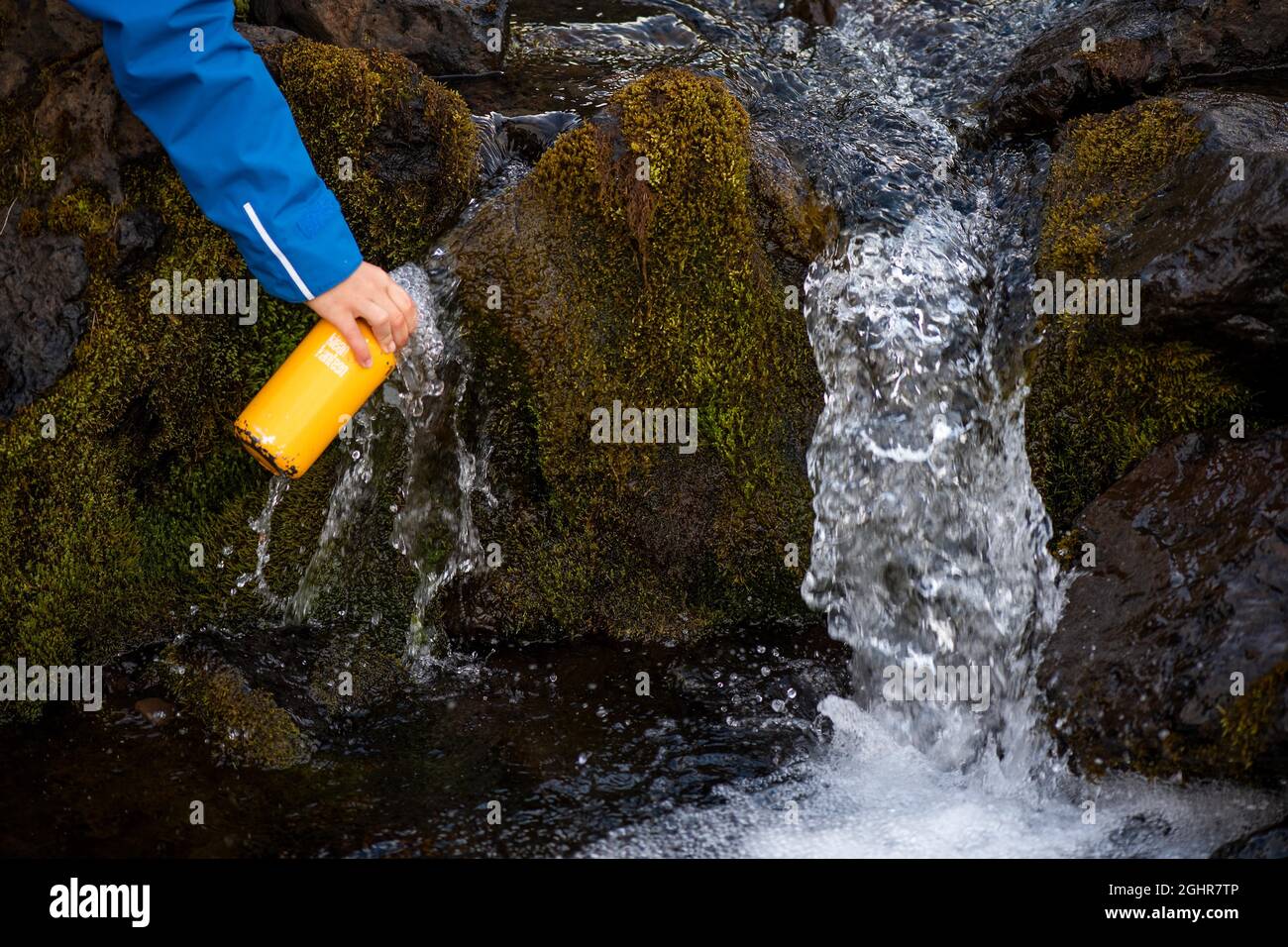 Child filling water bottle hi-res stock photography and images - Alamy